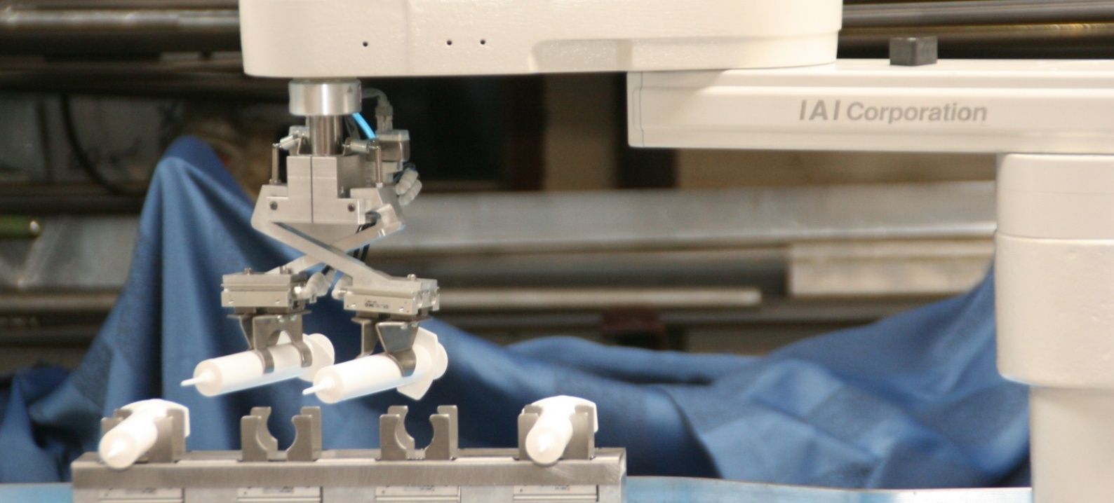 Filling machine pharmaceutical syringes with IAI scara robot - ATB ...